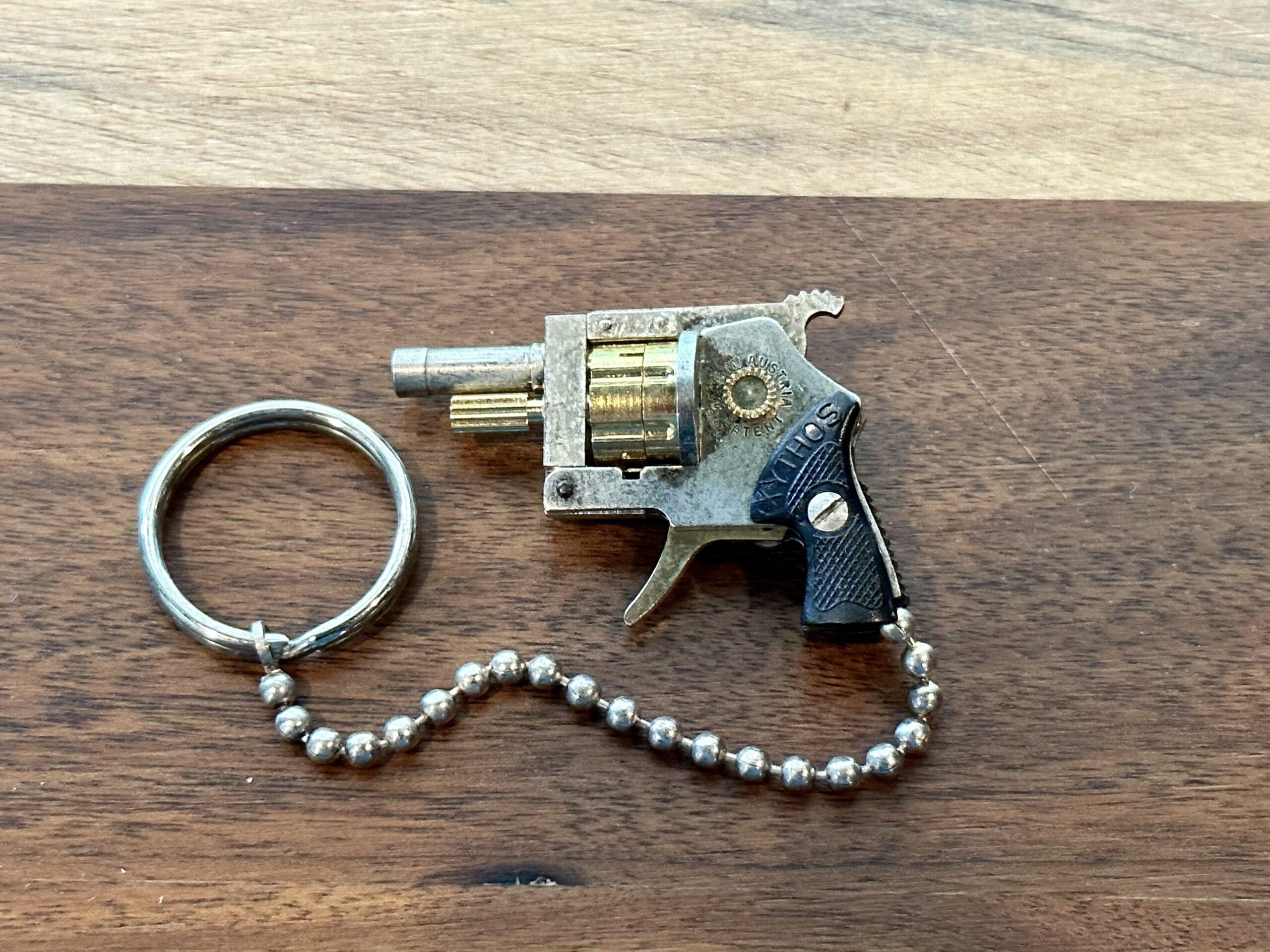 Uncommon variation of Xythos 2mm pinfire with attached keychain, and ...